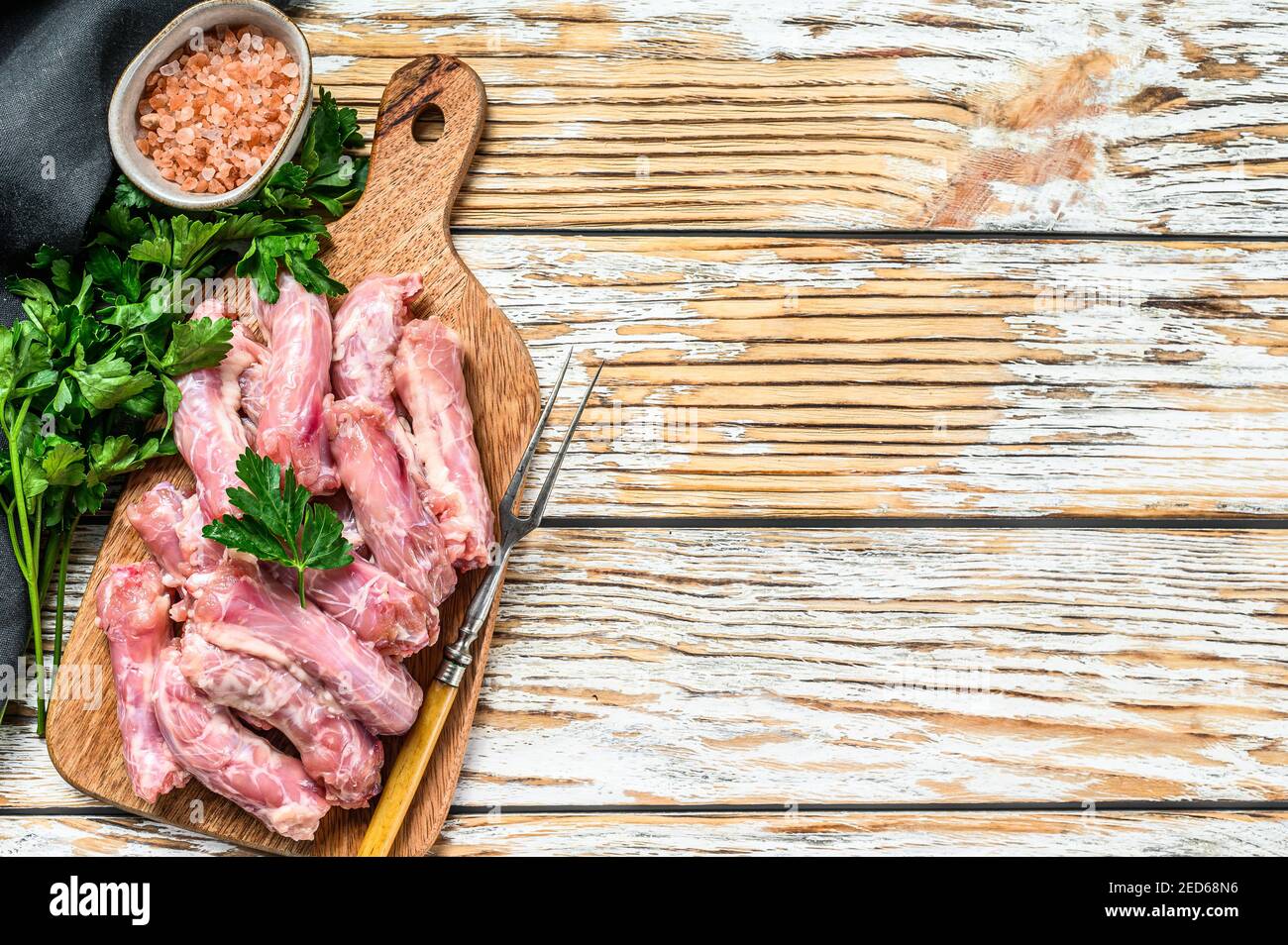Raw Chicken neck meat, offals. White Wooden background. Top view. Copy ...