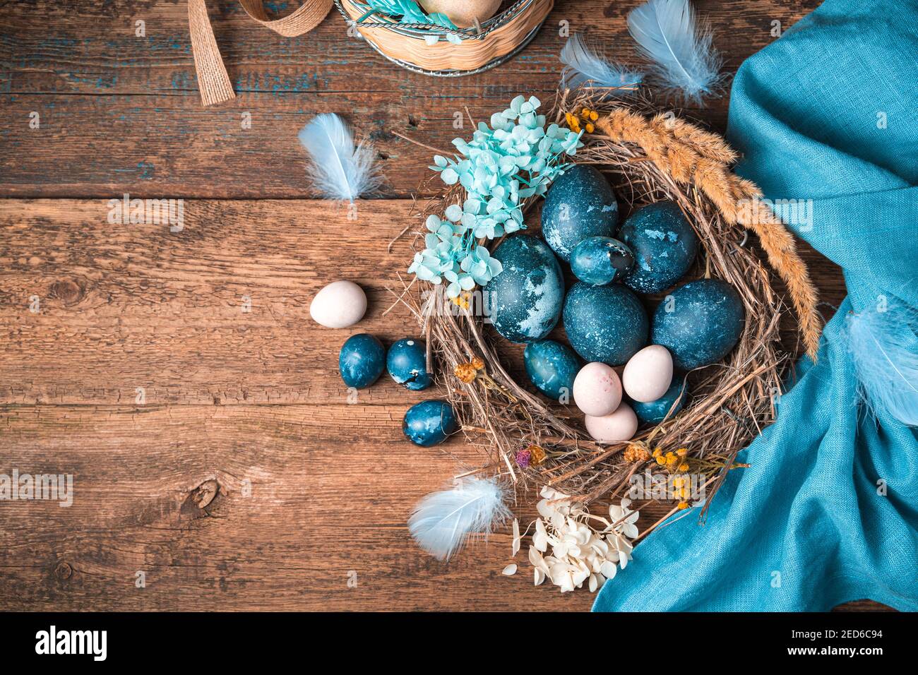 A set of quail and chicken eggs in dark blue and pastel colors in a ...