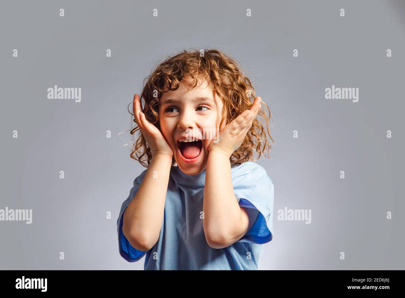 the pretty little girl expresses an emotion of joy Stock Photo - Alamy