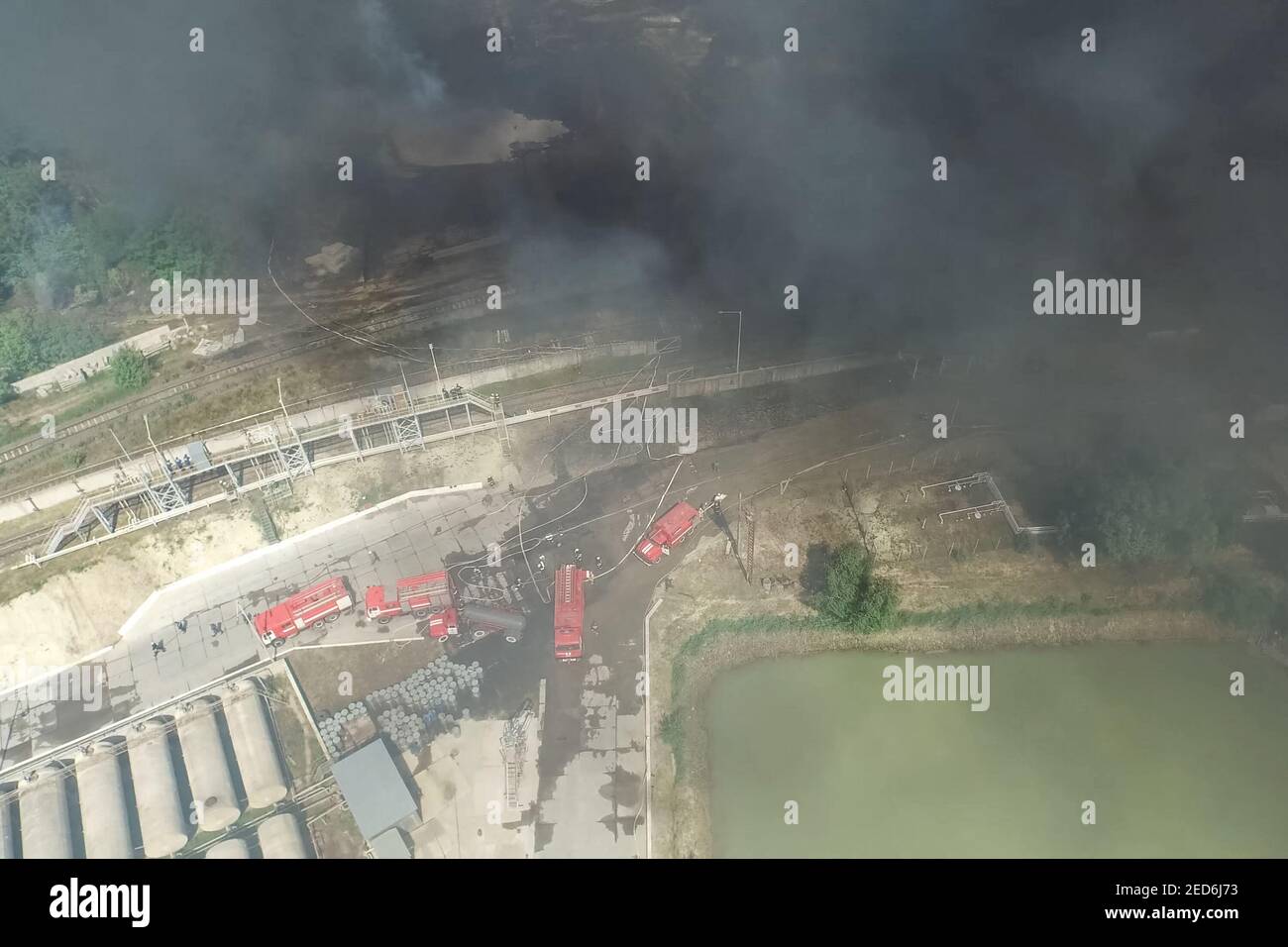 Oil storage fire. The tank farm is burning, black smoke is the ...