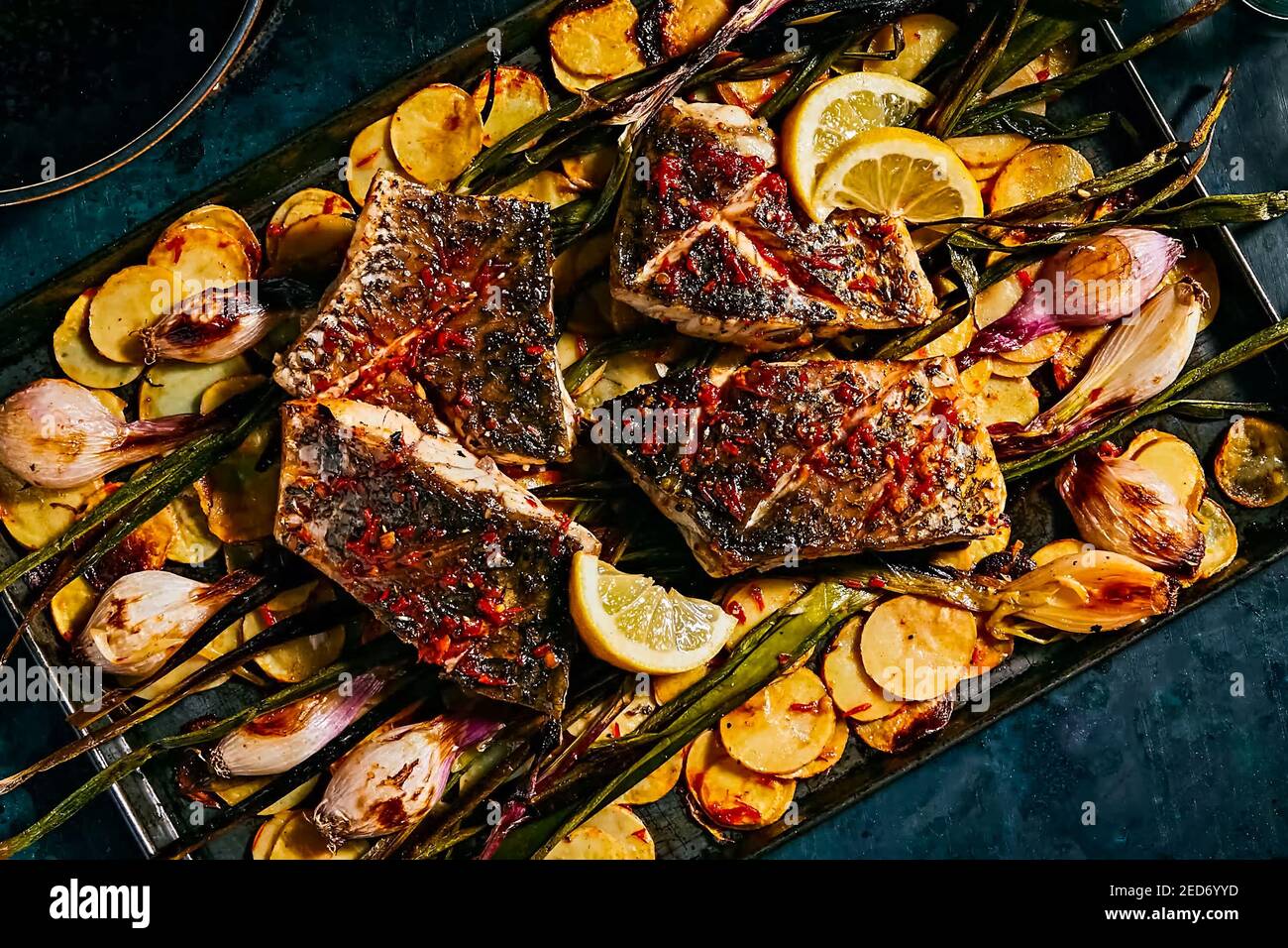 Fried fish fillet with chips and onions and lemon Stock Photo - Alamy