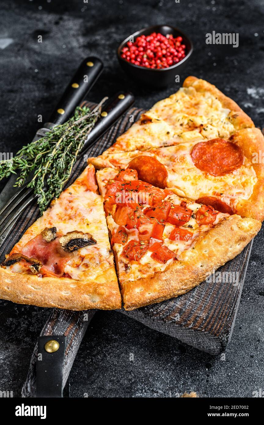 Set of Different slices of pizza. Black background. Top view Stock ...