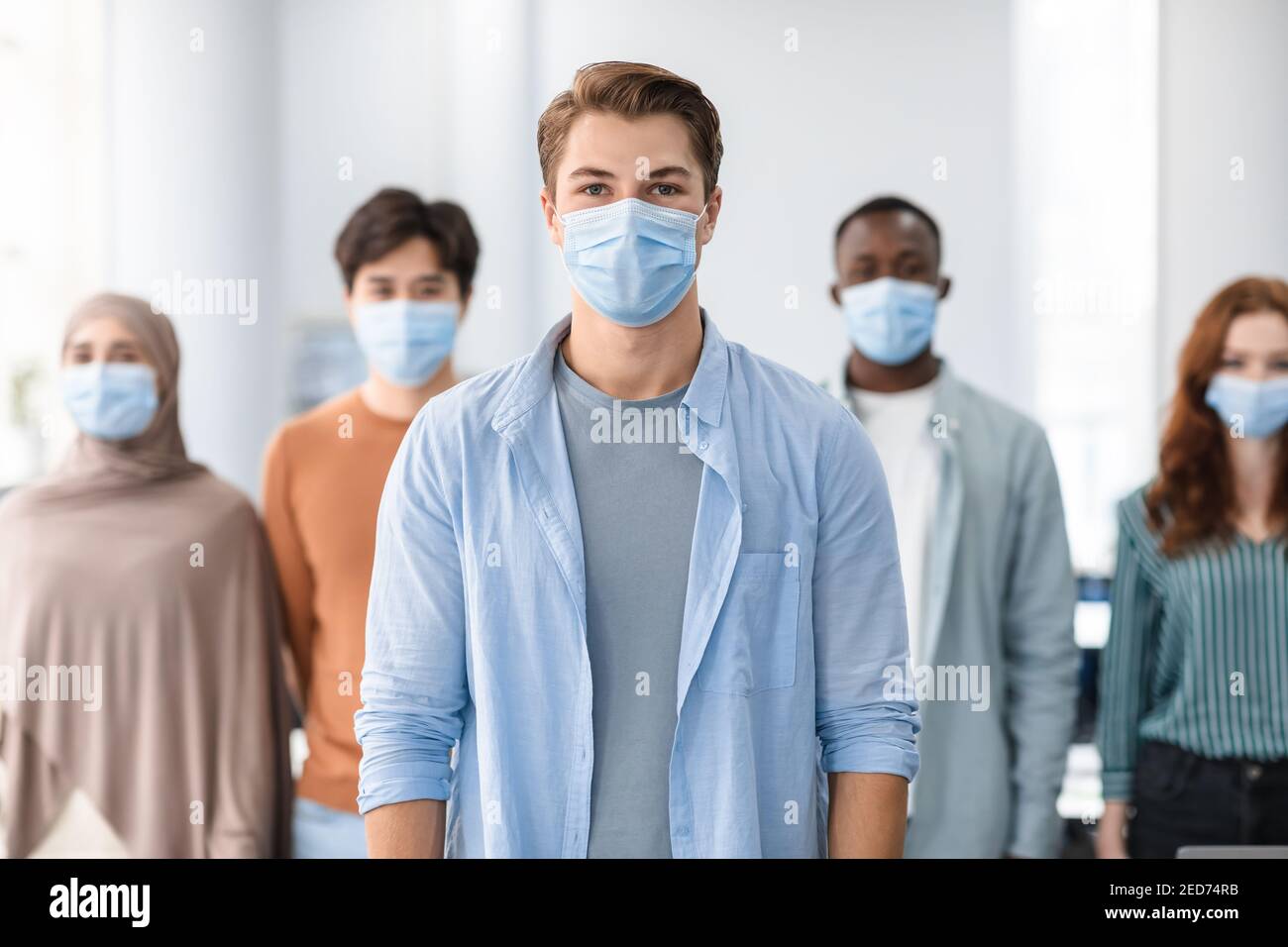 Diverse group of international people wearing medical face masks Stock ...