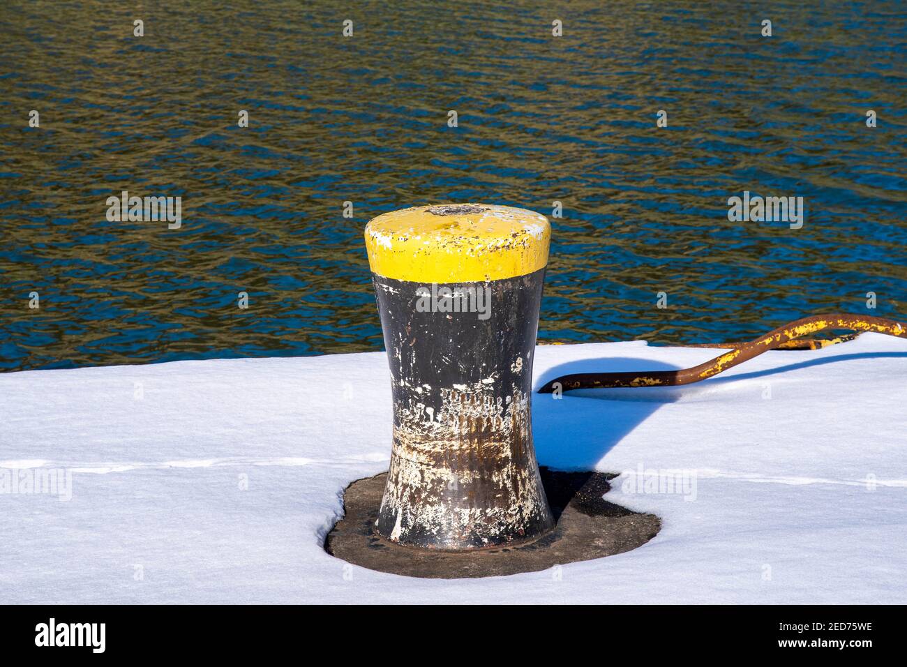 yellow bollard for navigation on Neckar river with snow Stock Photo - Alamy
