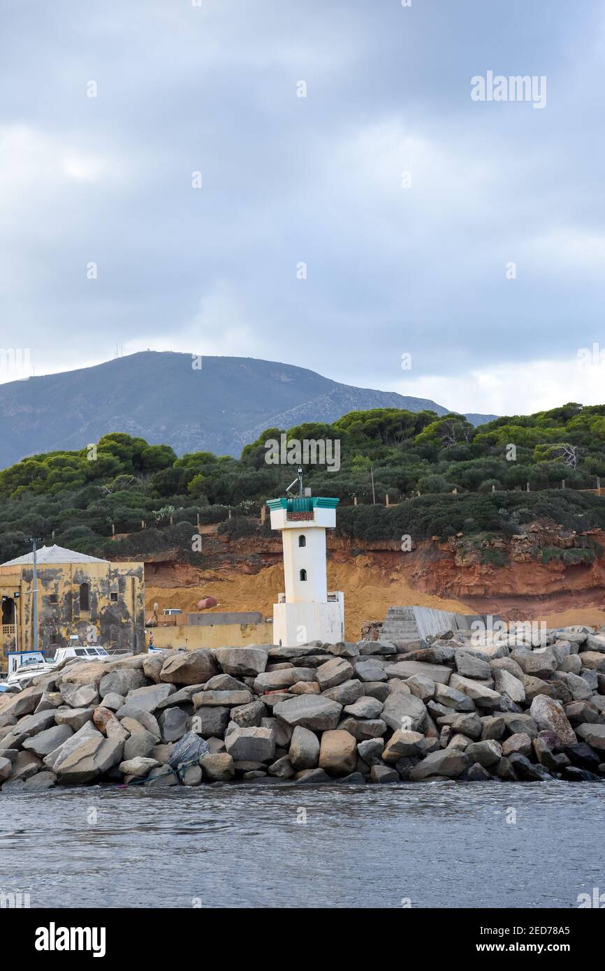 An old small lighthouse in the old port Stock Photo - Alamy