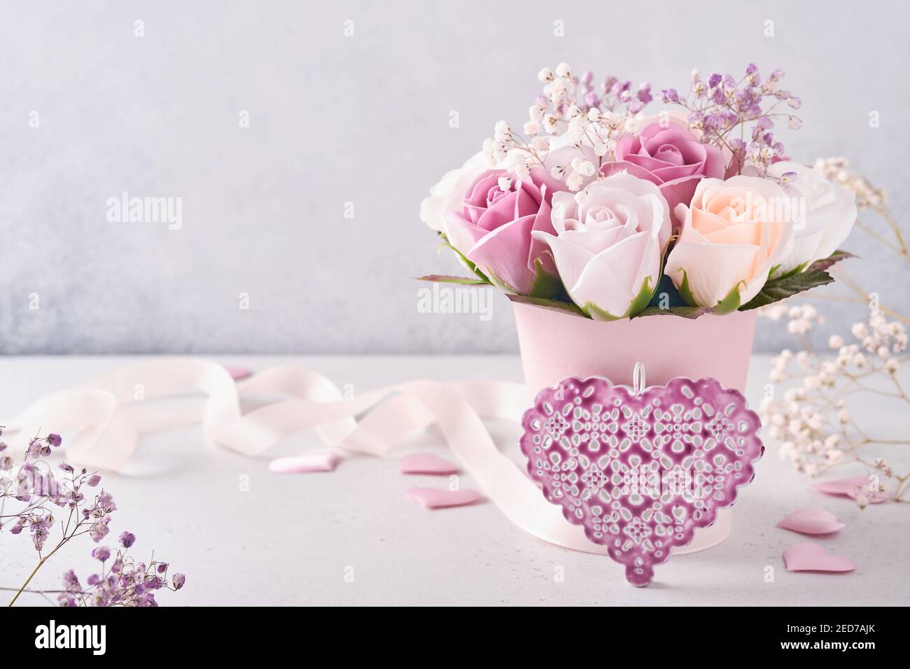 Festive composition with beautiful delicate roses flowers in pink round ...
