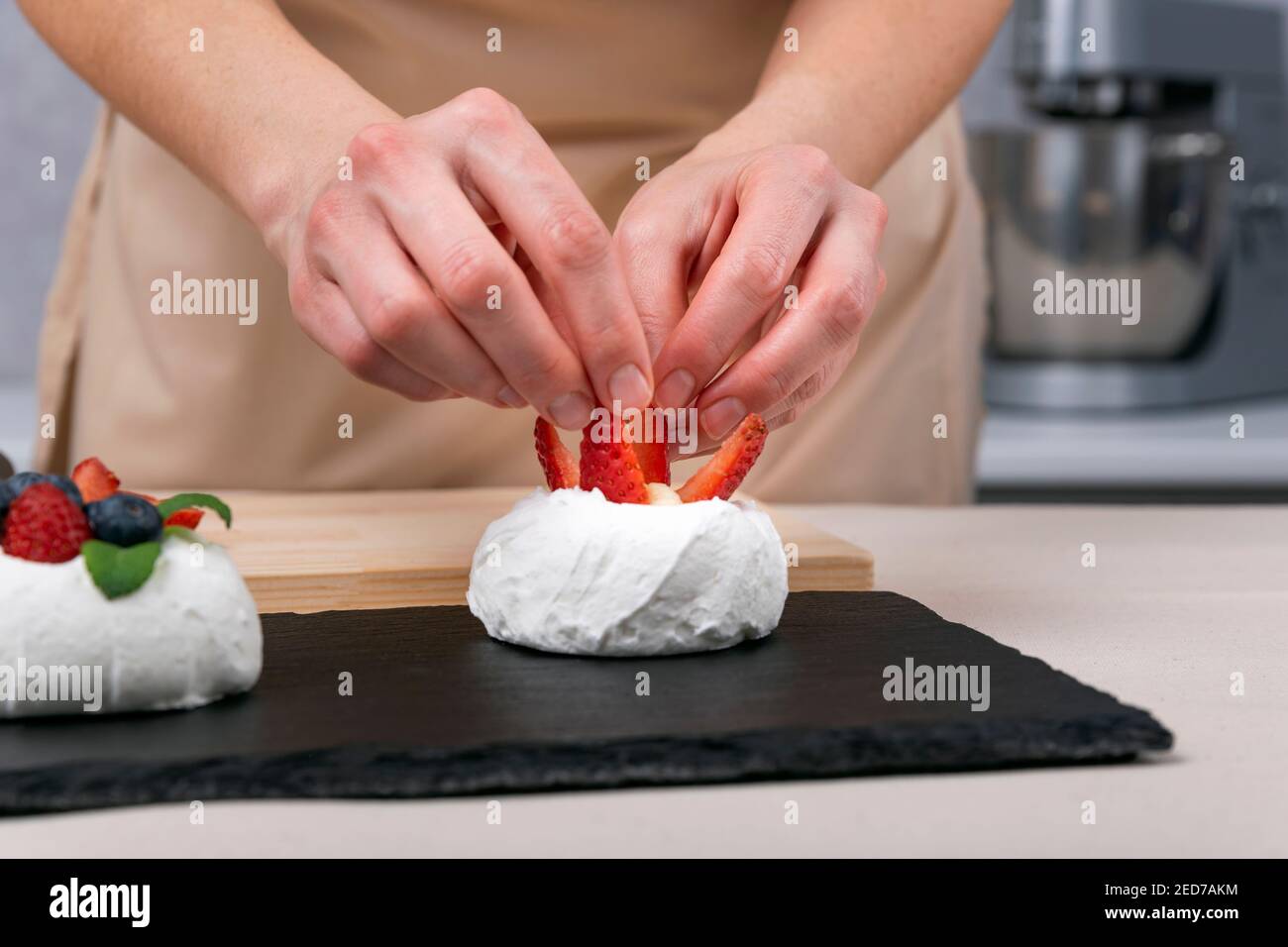 Female pastry chef prepares cake hi-res stock photography and images ...