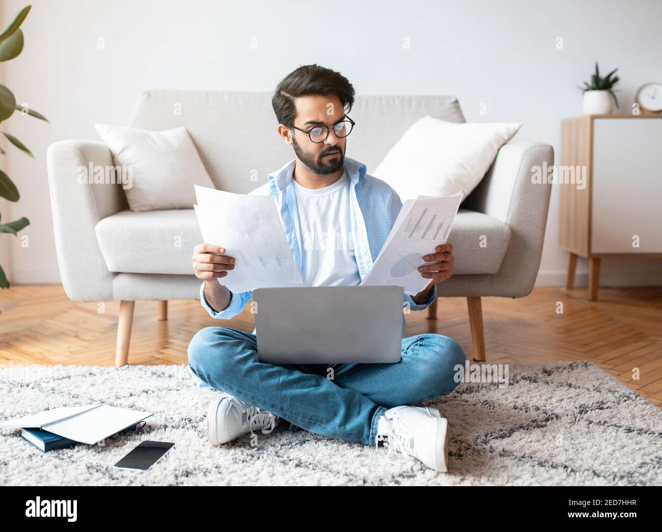 Remote Business. Busy Arab Man Working With Papers And Laptop At Home ...