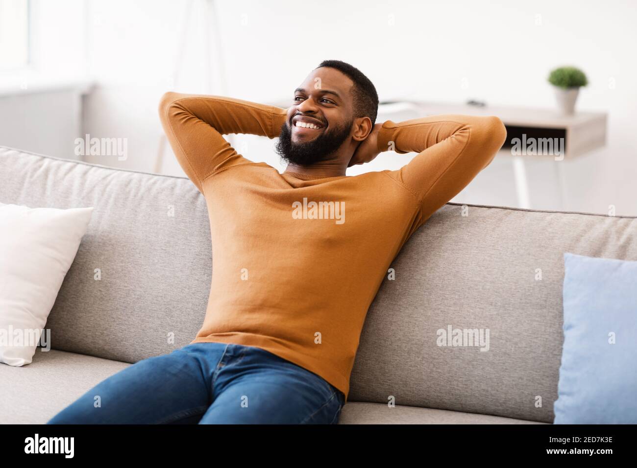 African man resting indoors hi-res stock photography and images - Alamy