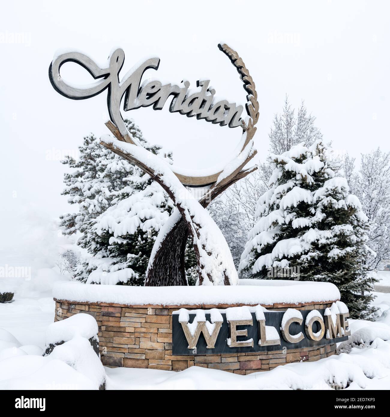 Snow covered sign welcoming people to Meridian Idaho Stock Photo - Alamy