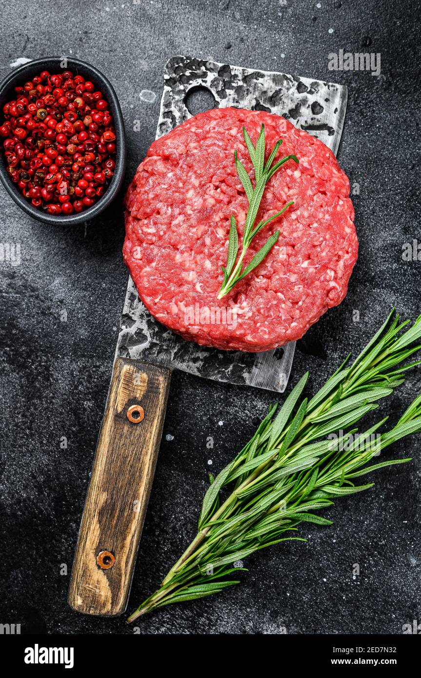 Burger Patty, ground beef meat. Black background. Top view Stock Photo ...