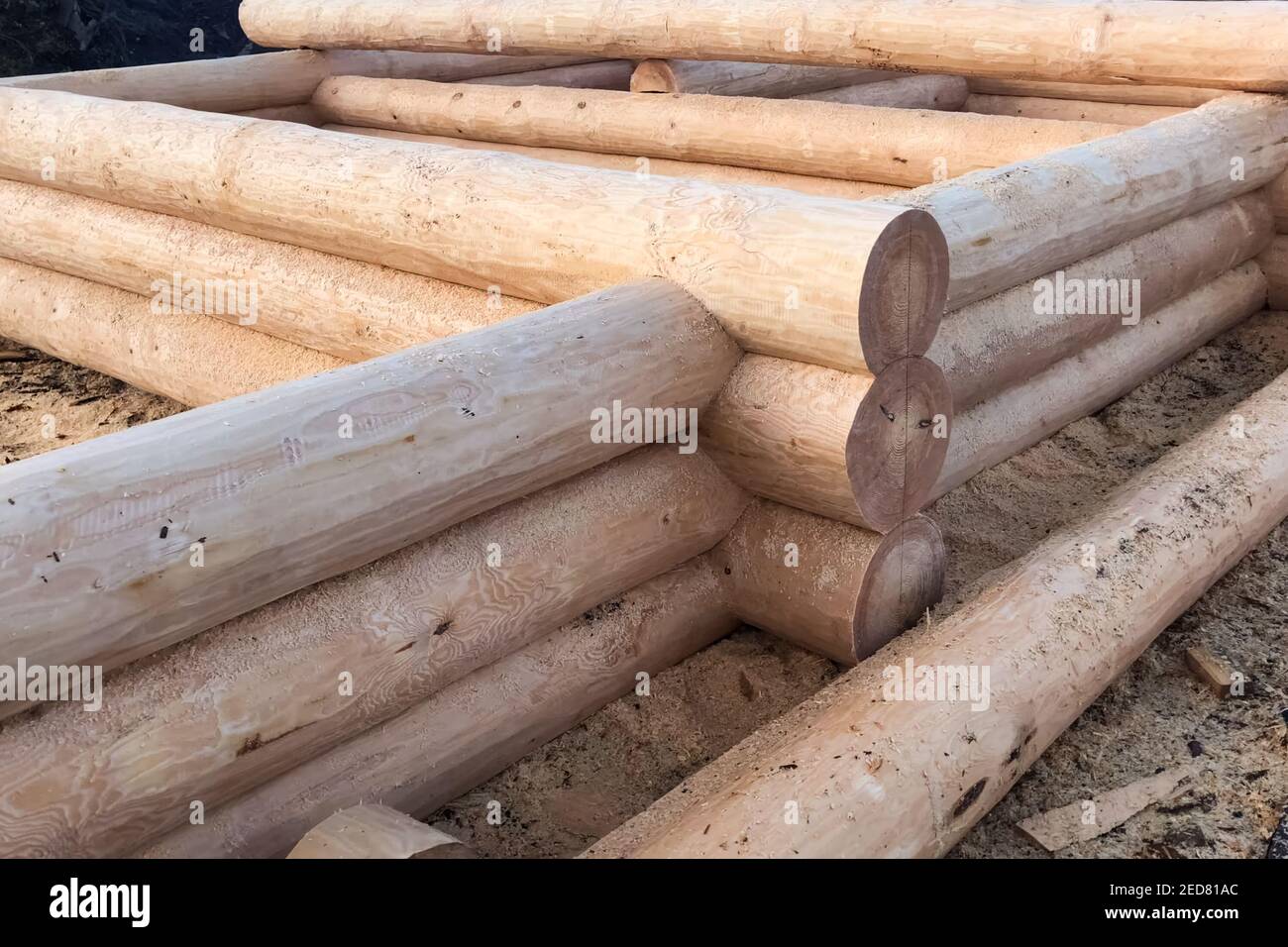 Drying and assembly of a wooden log house at a construction base ...