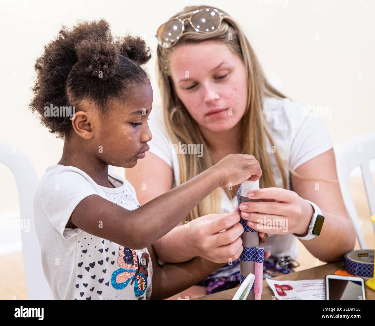 Children working on art projects in a classroom Stock Photo - Alamy