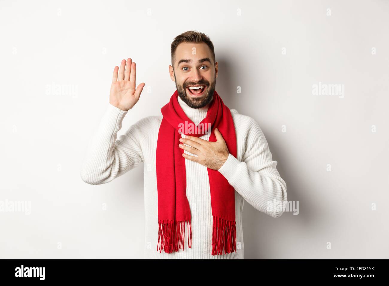Attractive caucasian man telling truth, holding hand on heart and ...