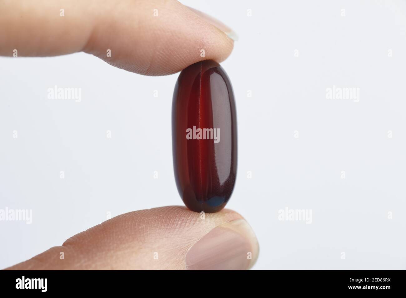 Close up photo of capsule in a fingers. Heap of pills - medical ...