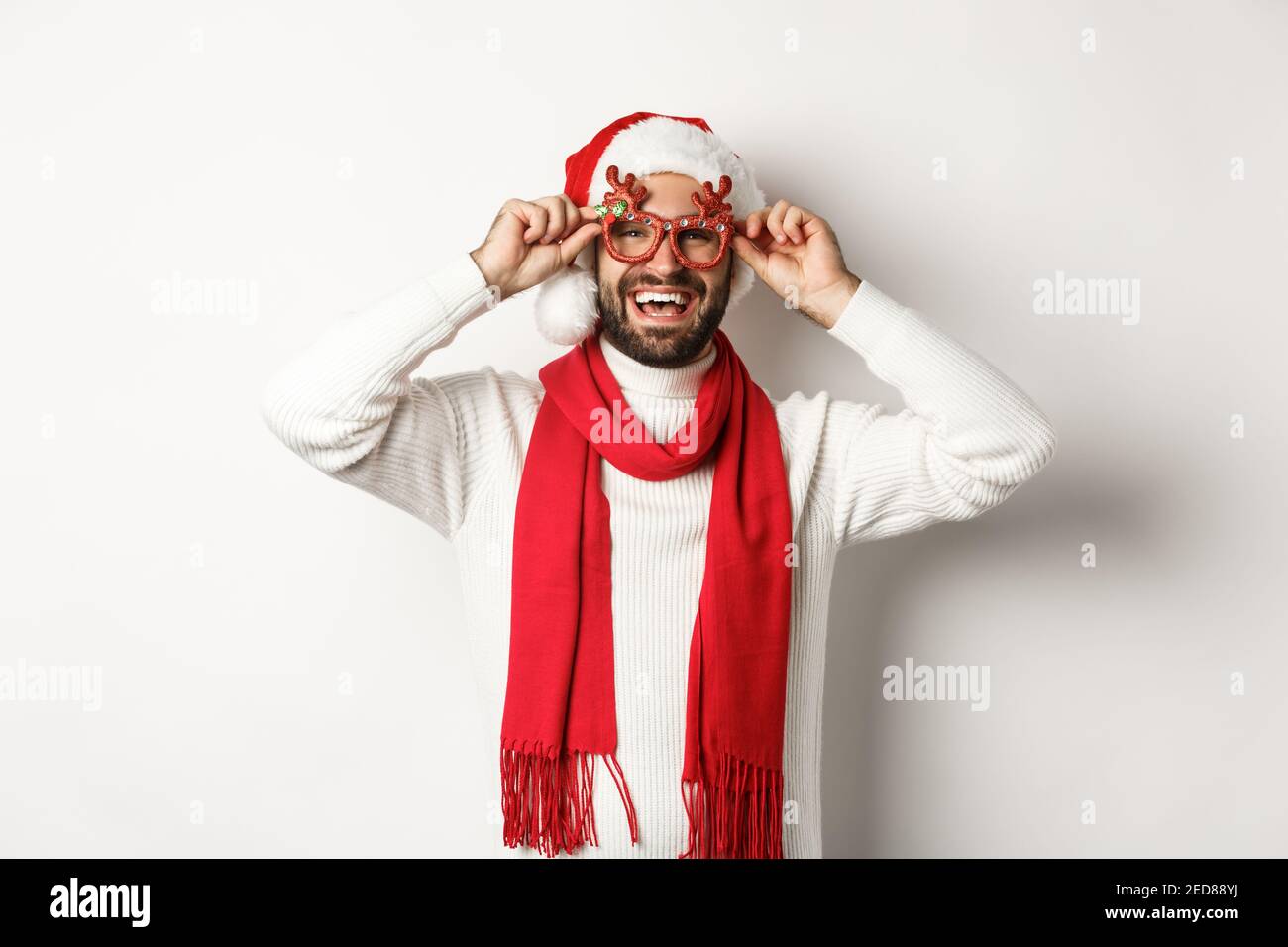 Christmas, New Year and celebration concept. Happy man laughing ...