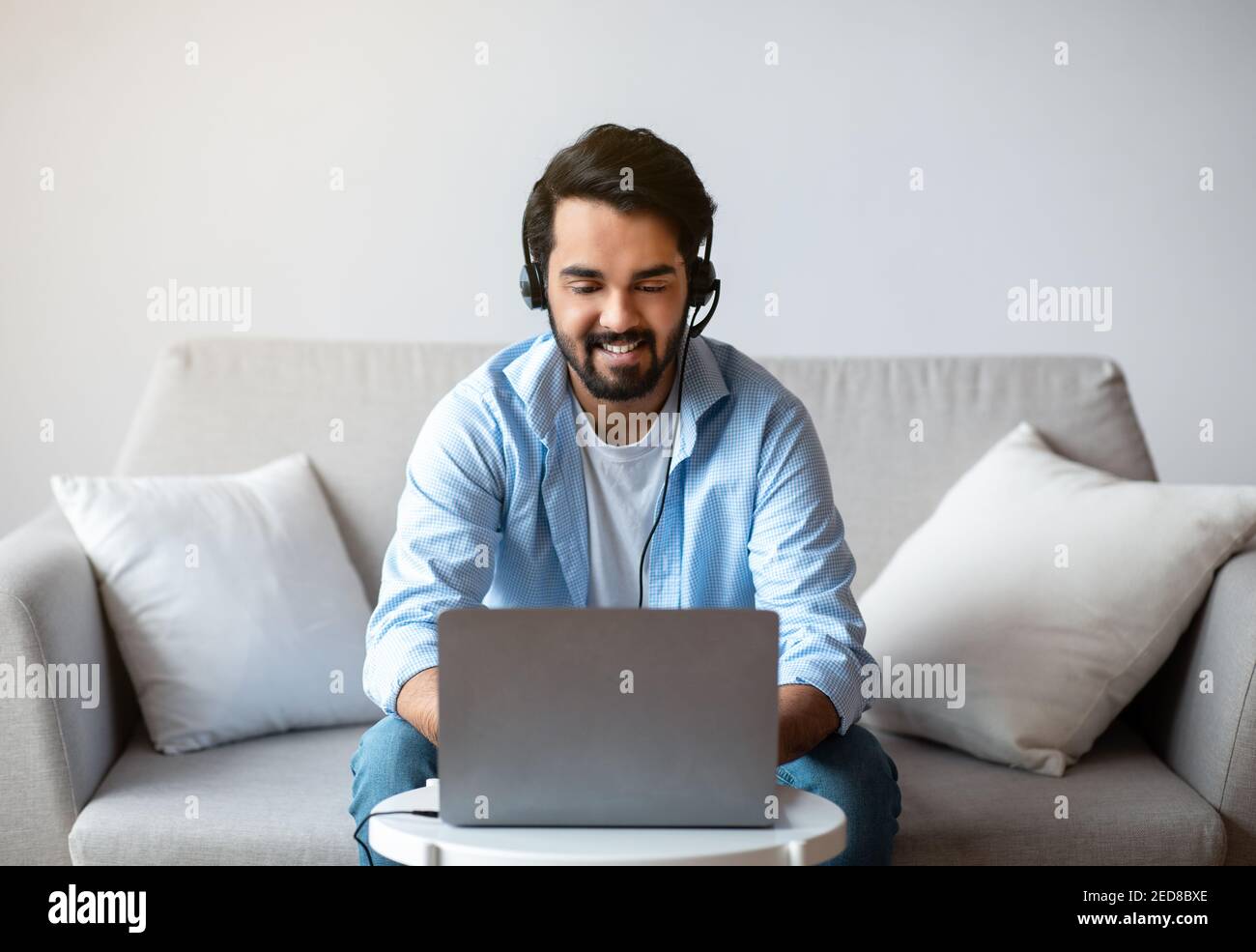 Distance Learning. Smiling Arab Man In Headset Study With Laptop At ...