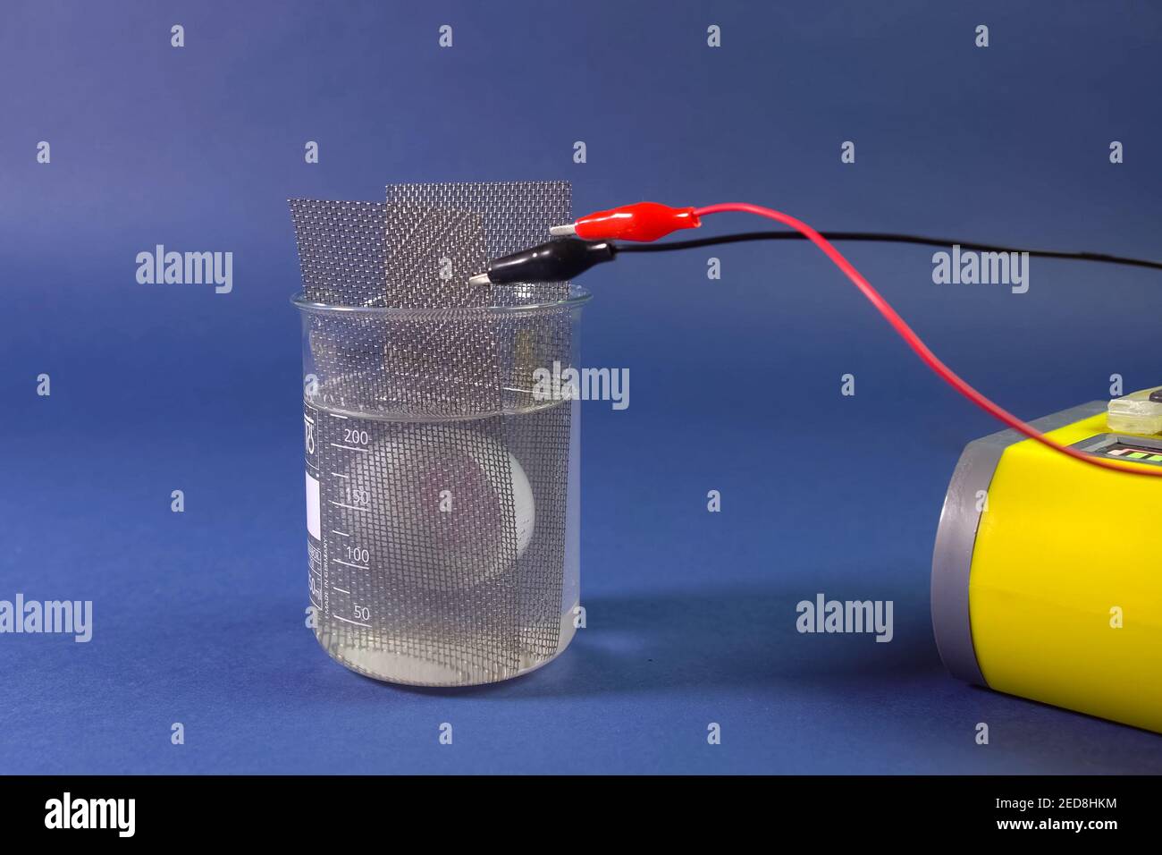 Checking the conductivity of the substance. Anode and cathode in a ...