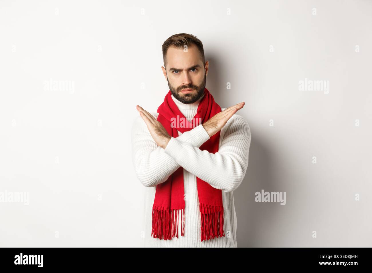 Angry bearded man frowning, showing cross stop gesture, telling no ...