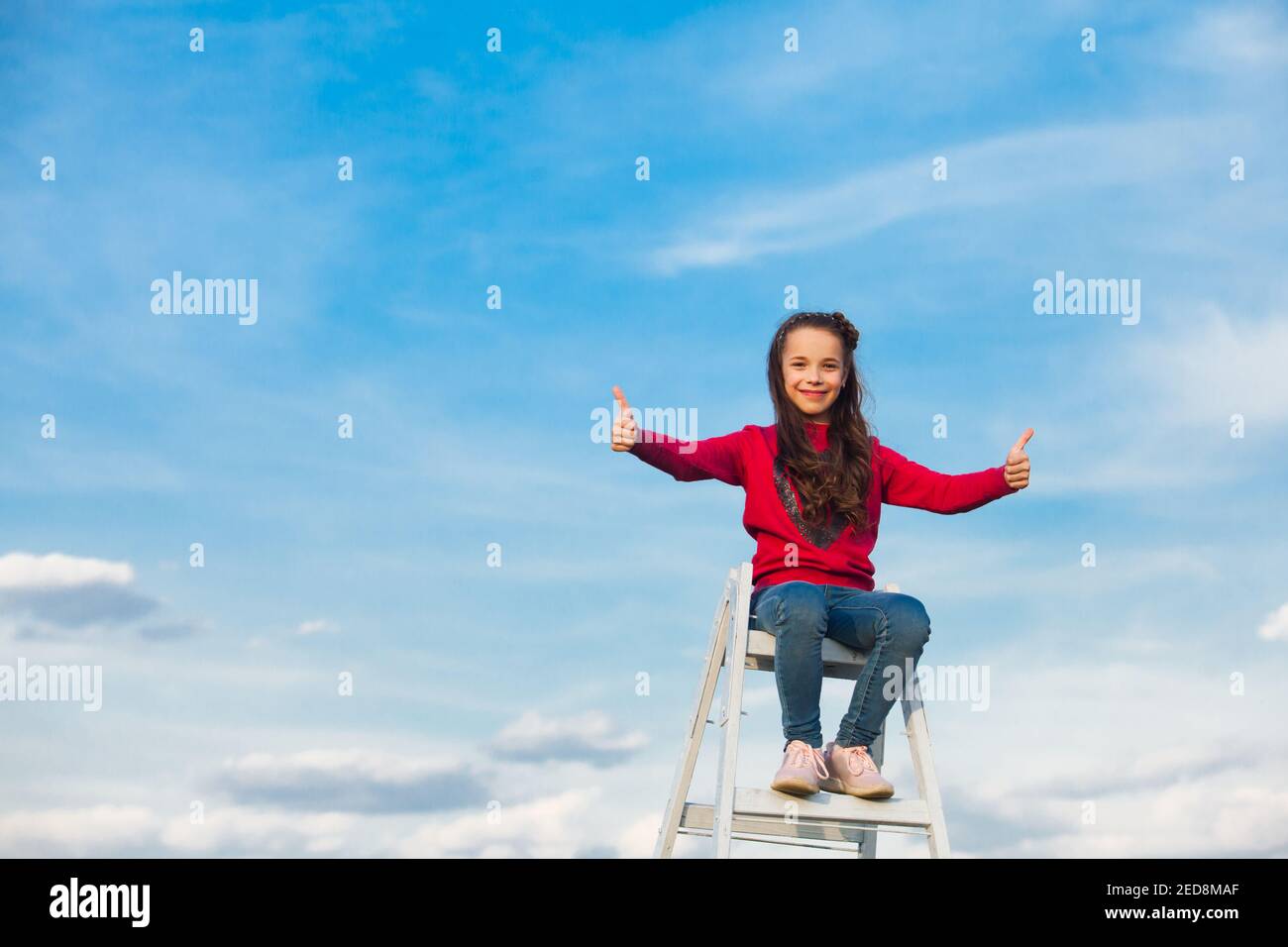 Woman up a ladder outside hi-res stock photography and images - Alamy