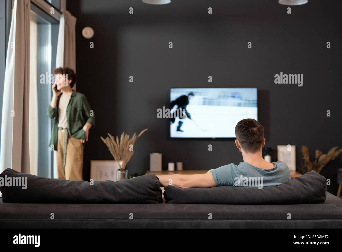 Sitting watching tv communication technology television hi-res stock ...