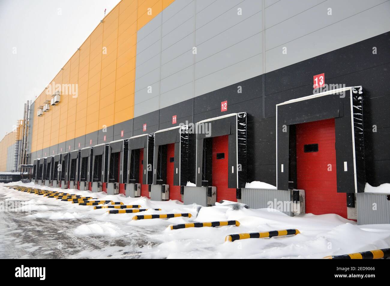 Empty loading area of a large warehouse in winter. Warehouse logistics ...
