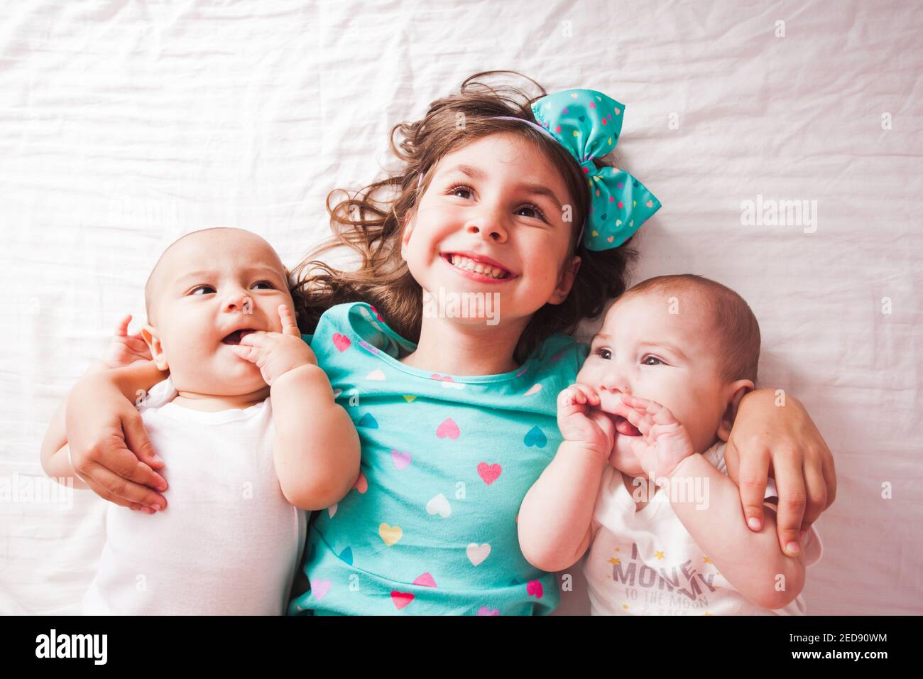 the strong family relationships of little kids Stock Photo - Alamy