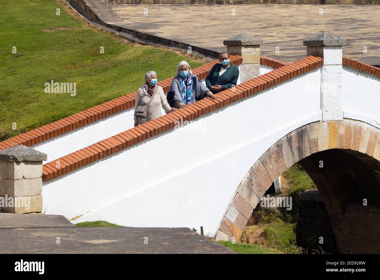 Group of women travelling. The famous historic Bridge of Boyaca in ...