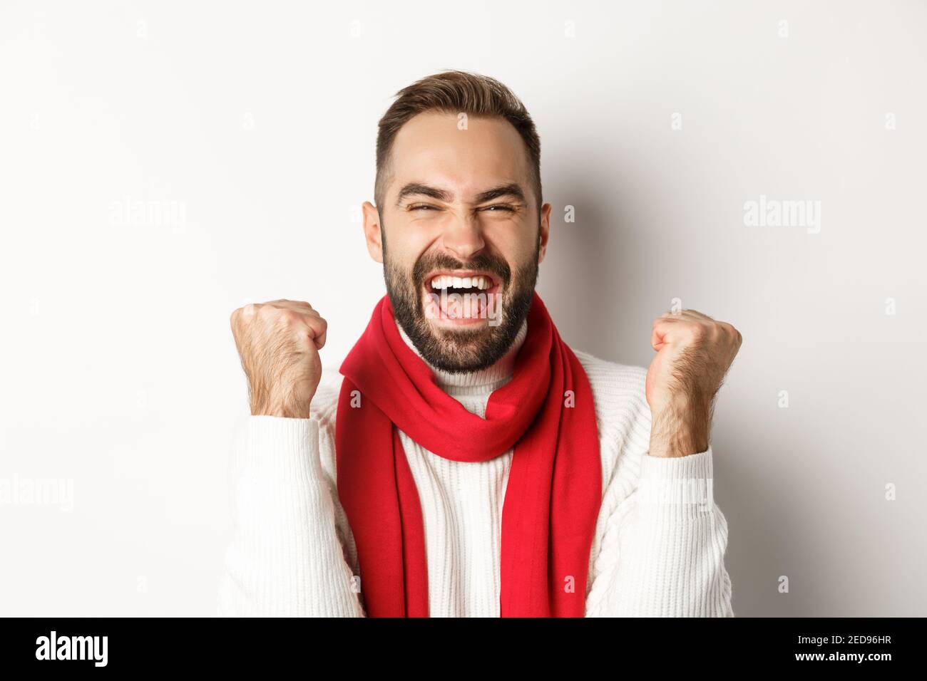 Christmas holidays. Close-up of happy guy winner, celebrating victory ...