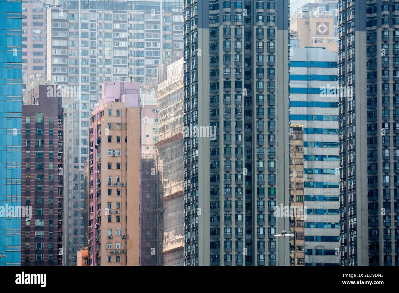 Dense view of the facade of high rise housing blocks and skyscrapers ...
