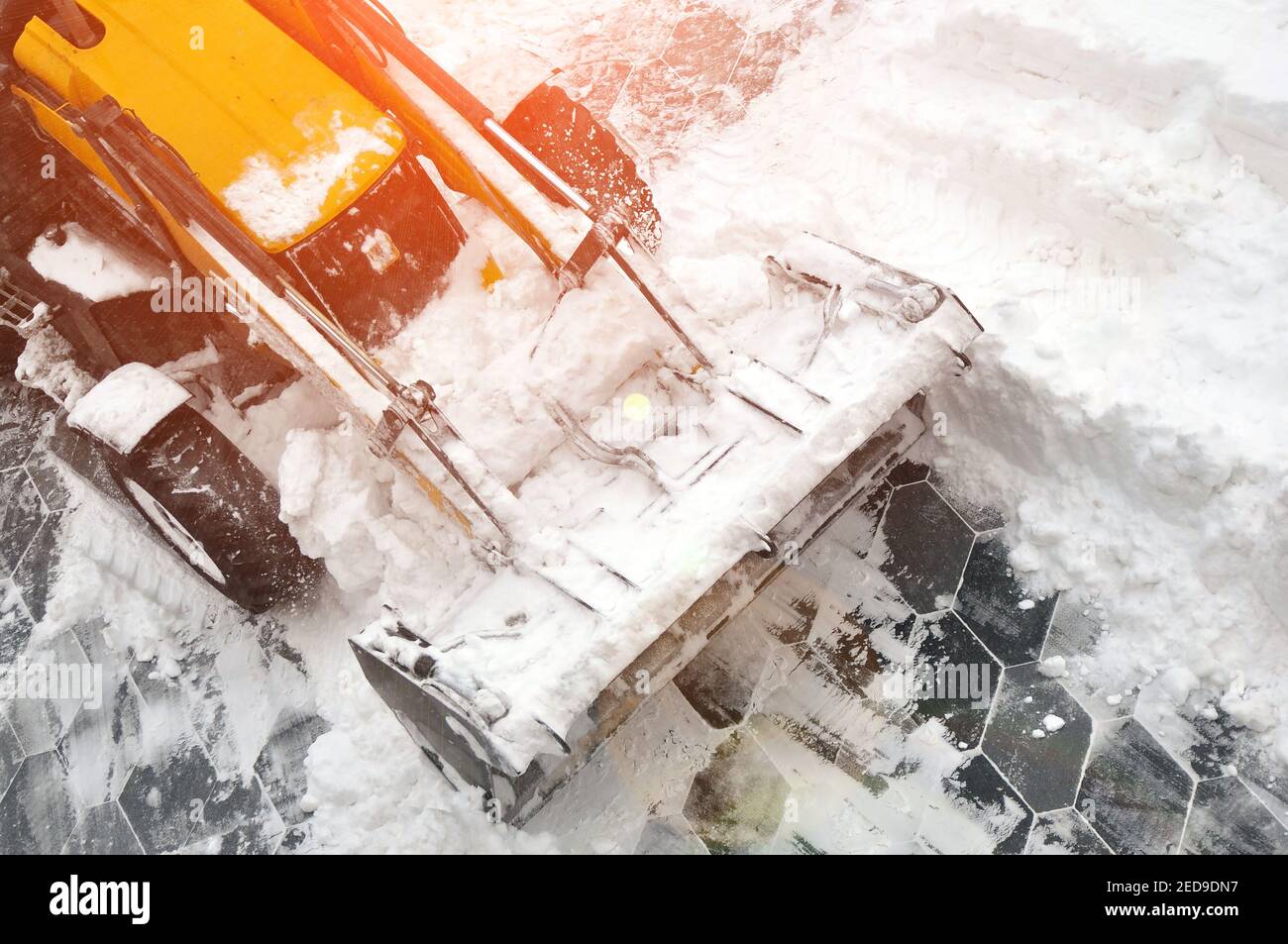 Removing snow accumulations using a tractor with attachments Stock ...