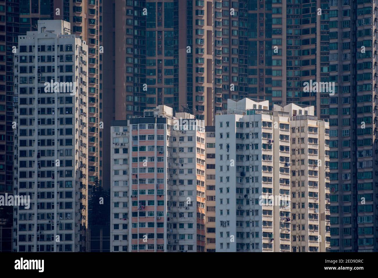 Dense view of the facade of high rise housing blocks and skyscrapers ...