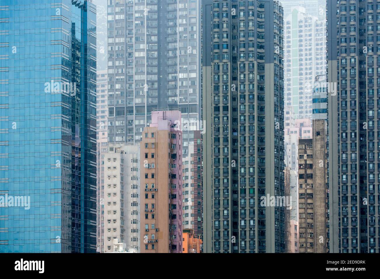 Dense view of the facade of high rise housing blocks and skyscrapers ...
