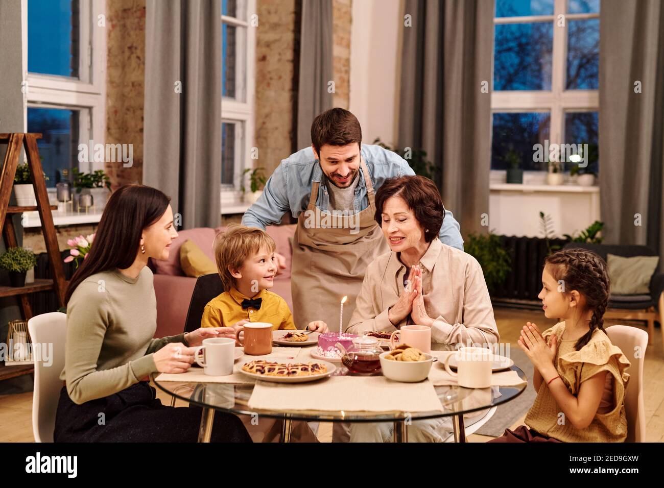 Young man bending over table hi-res stock photography and images - Alamy