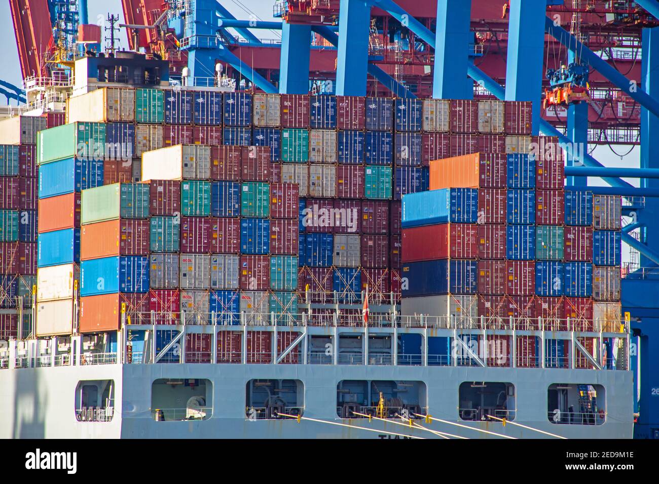 Container ship with colorful containers on the vessel quayside in the ...