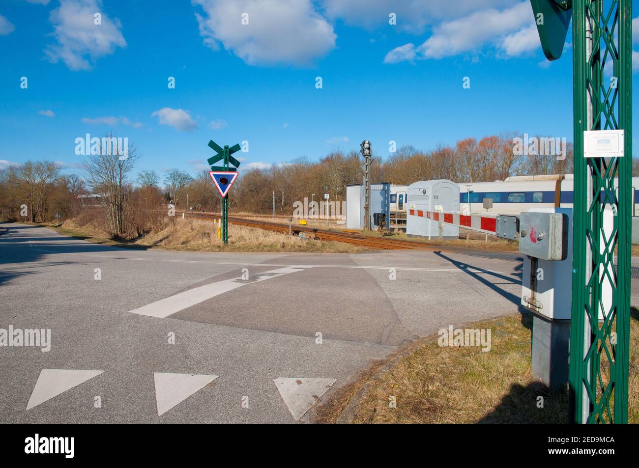 Railroad crossing in town of Tollose in Denmark Stock Photo - Alamy