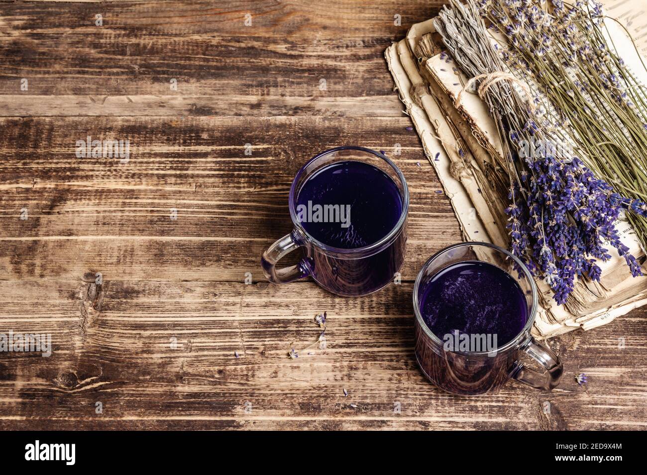 Lavender hot tea on vintage wooden table. Natural organic flower drink ...