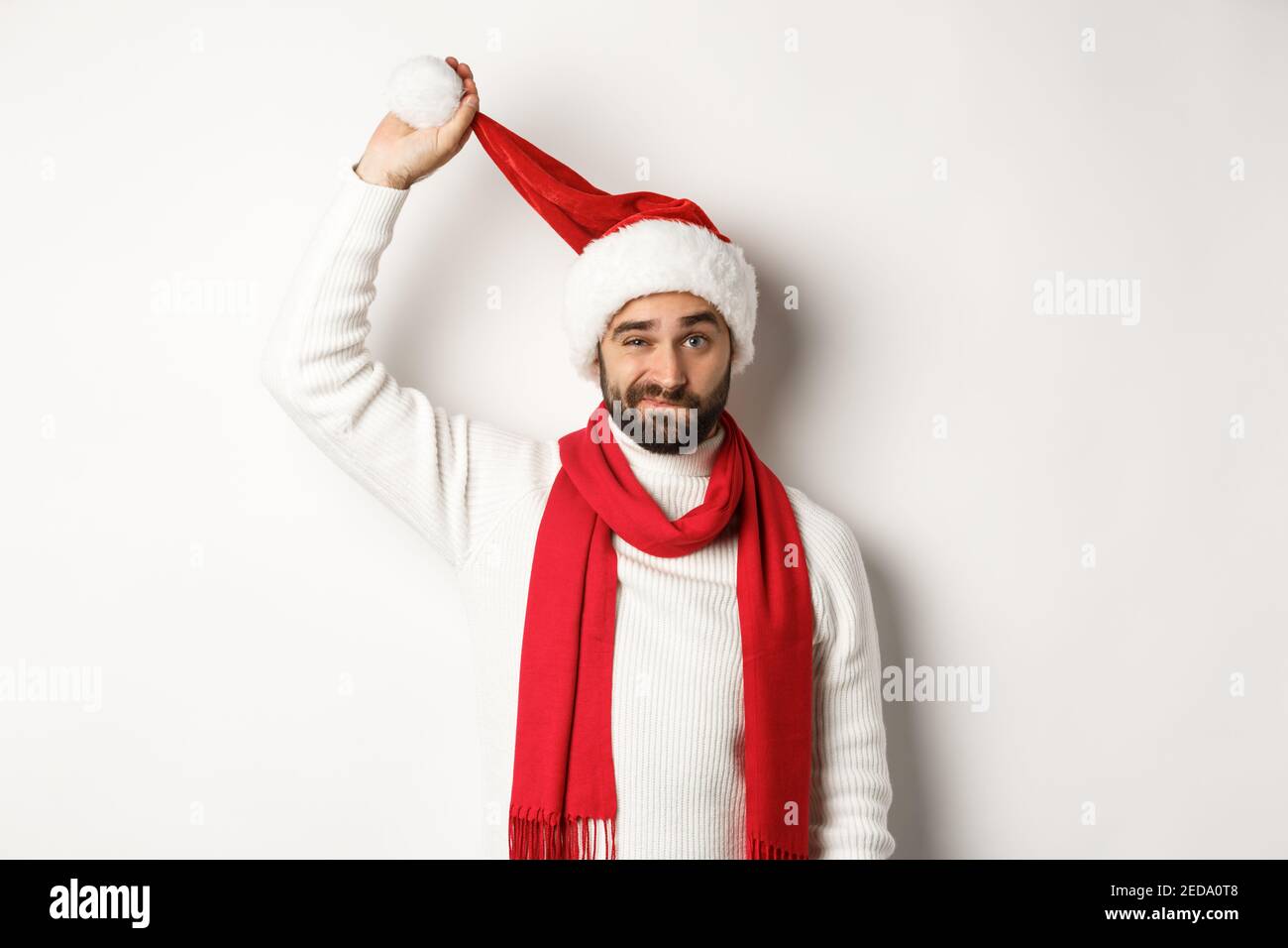 Christmas party and celebration concept. Sad guy taking-off Santa hat ...