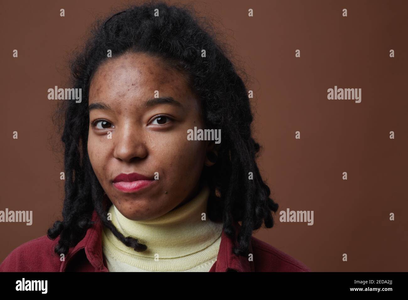 Close Up Portrait Of Real African American Woman Looking At Camera