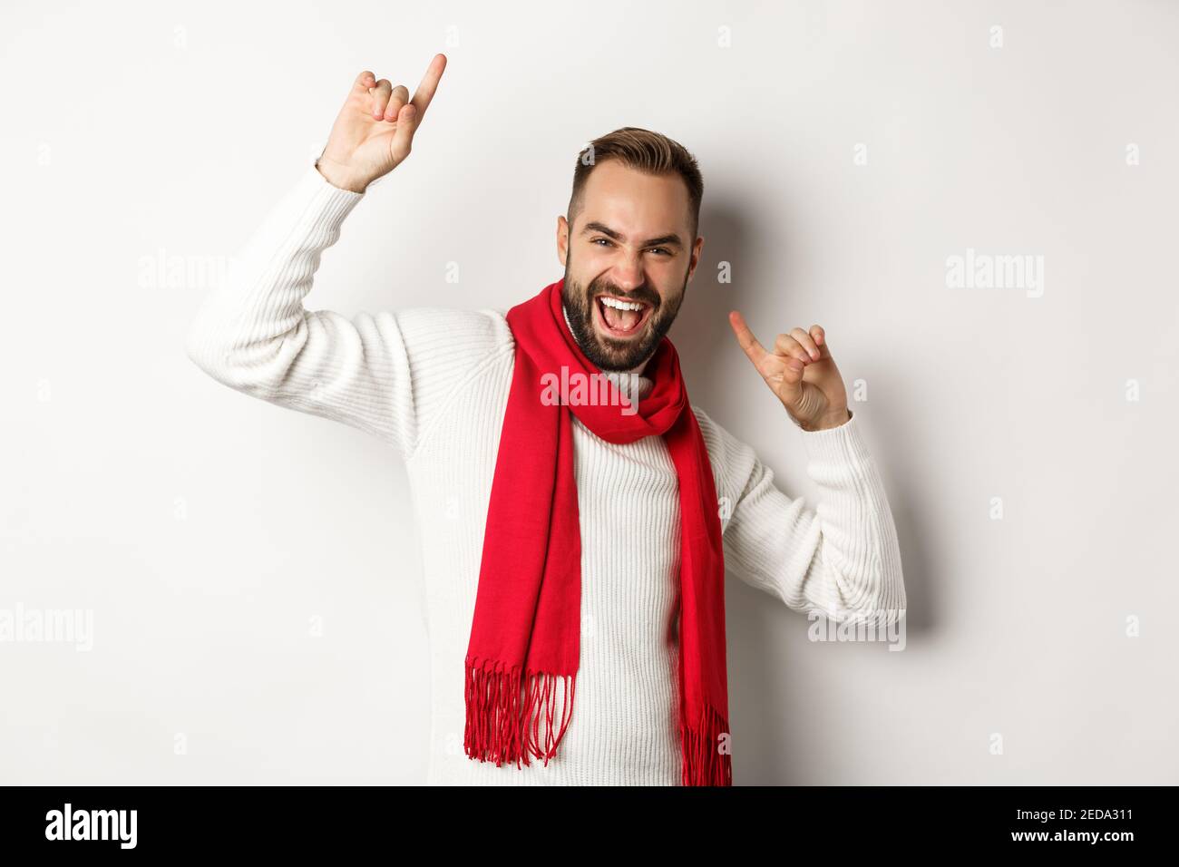 Happy bearded man celebrating new year party, dancing and pointing ...