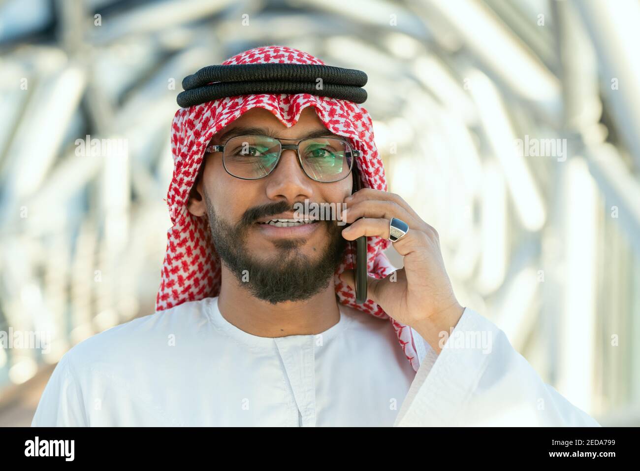 Cheerful middle eastern businessman using hi-res stock photography and ...
