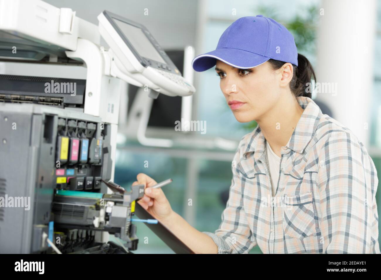 happy young woman on printer maintenance Stock Photo - Alamy
