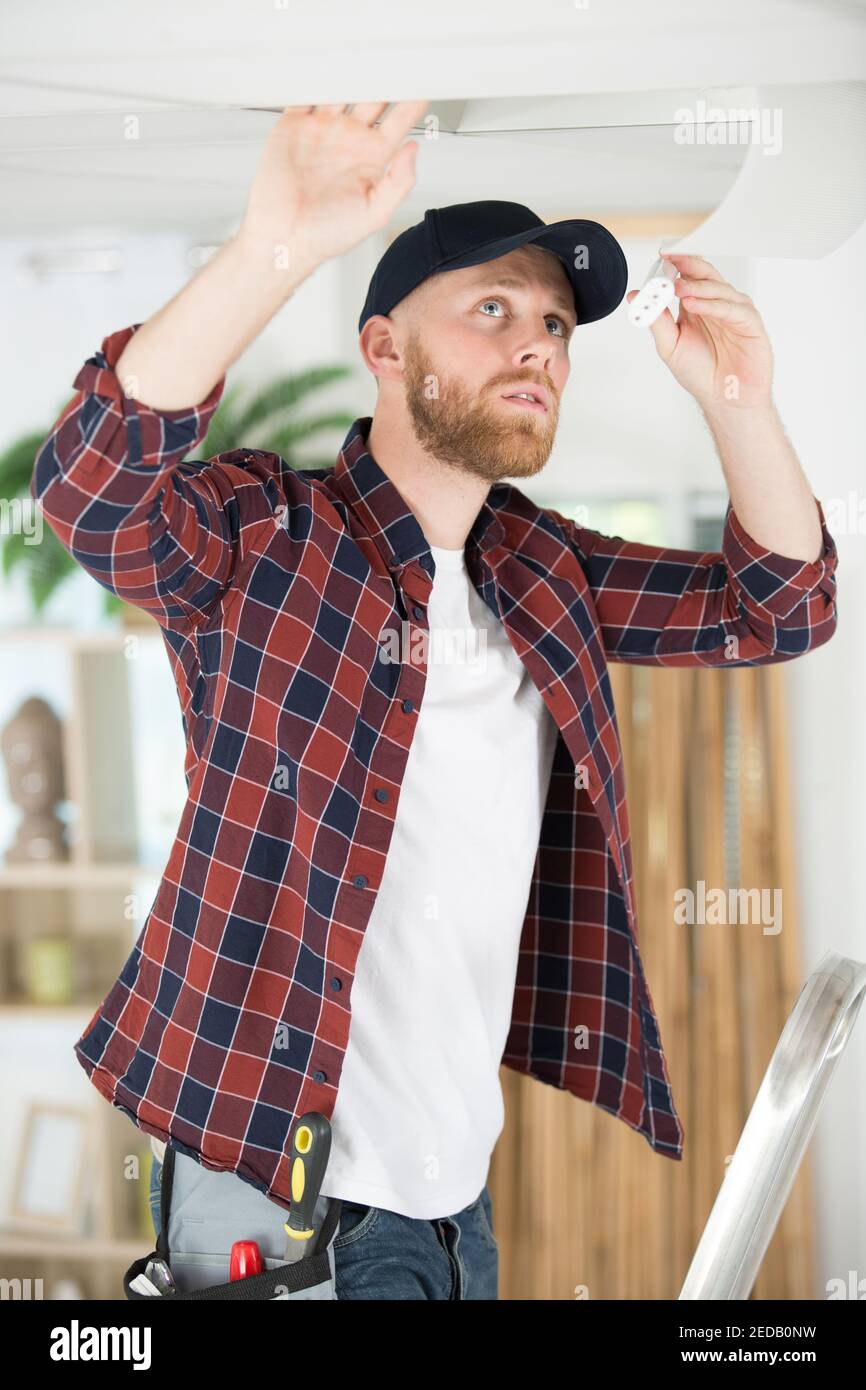 fixing of ceiling light Stock Photo - Alamy