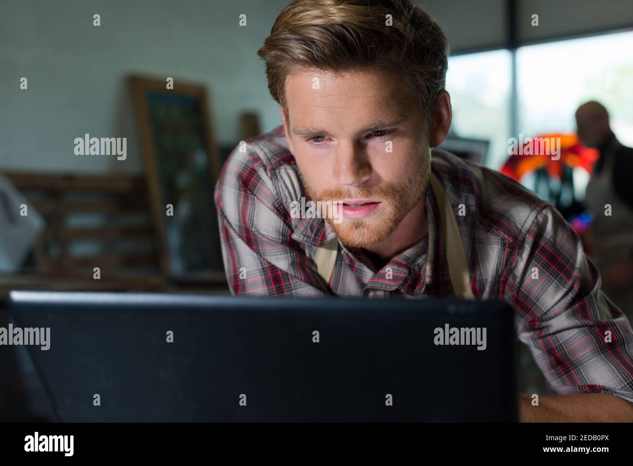 joyful cute guy is laboring with pleasure Stock Photo - Alamy