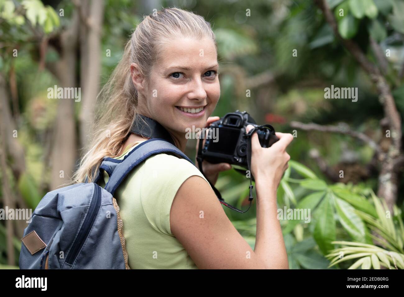 professional woman photographer taking camera outdoors Stock Photo - Alamy