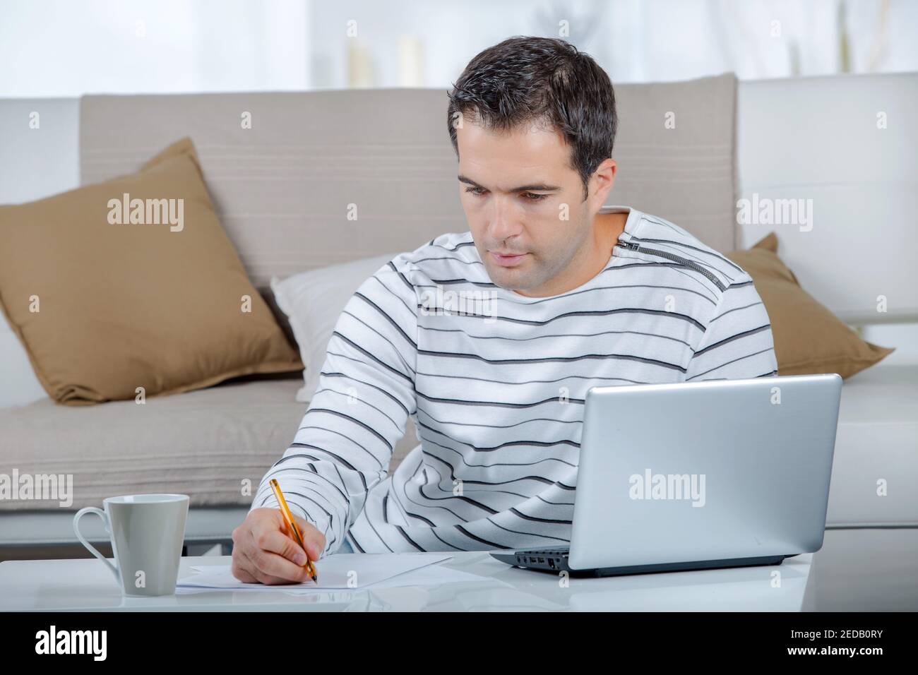 a man is taking notes Stock Photo - Alamy