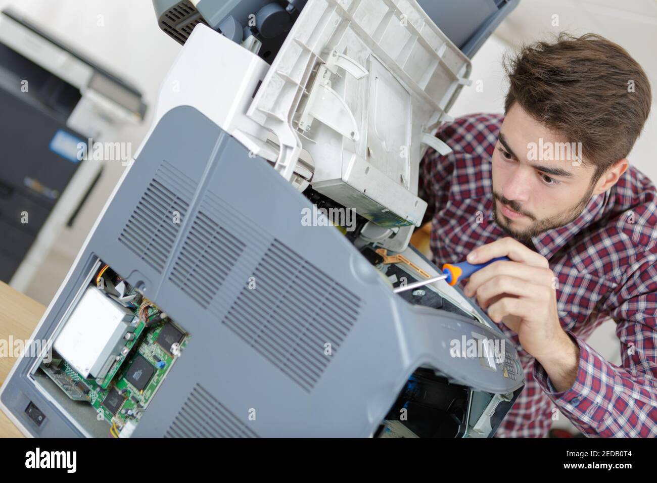 technician working on photocopier lid open Stock Photo - Alamy