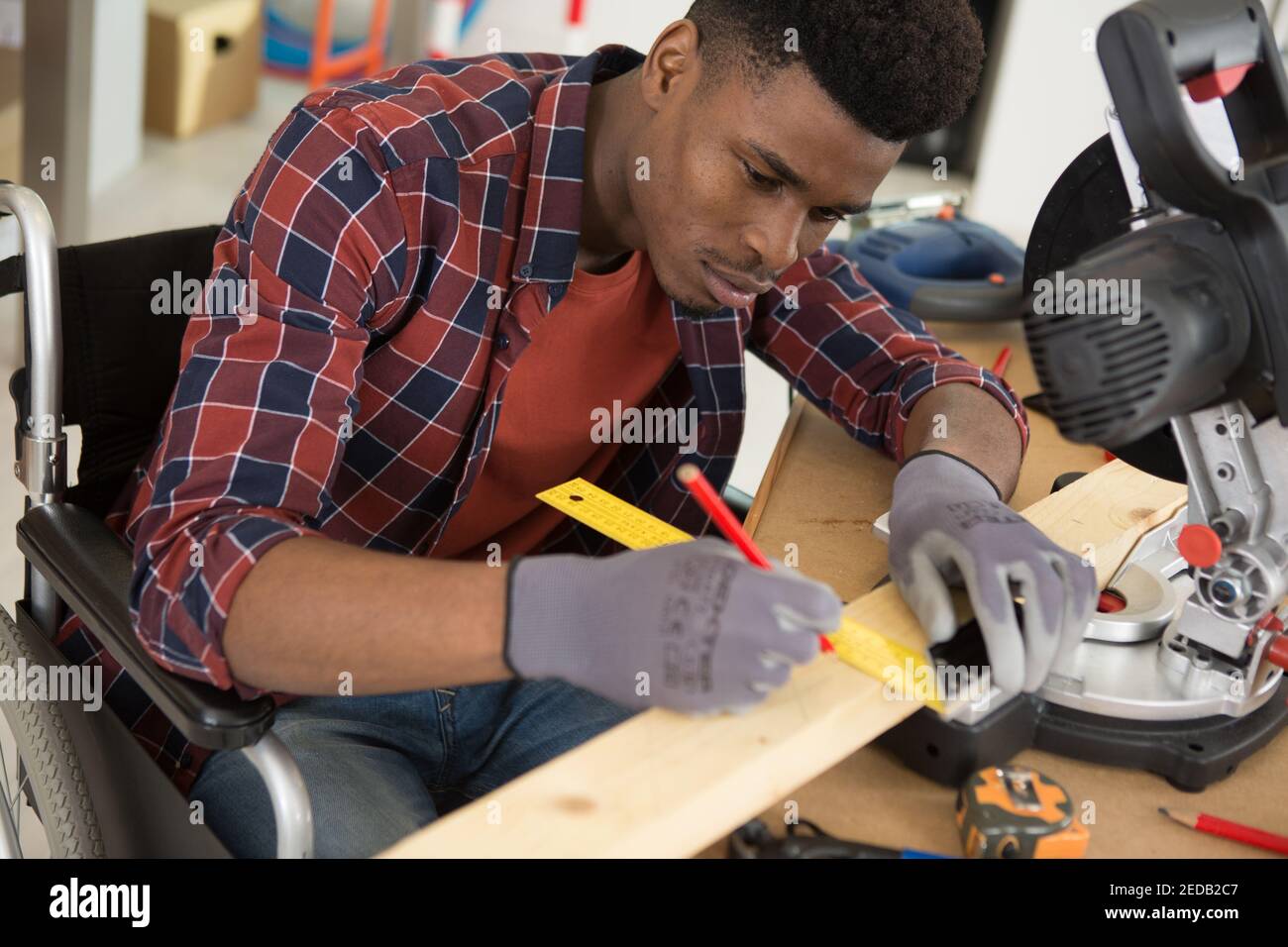 disabled man working with circular saw Stock Photo - Alamy