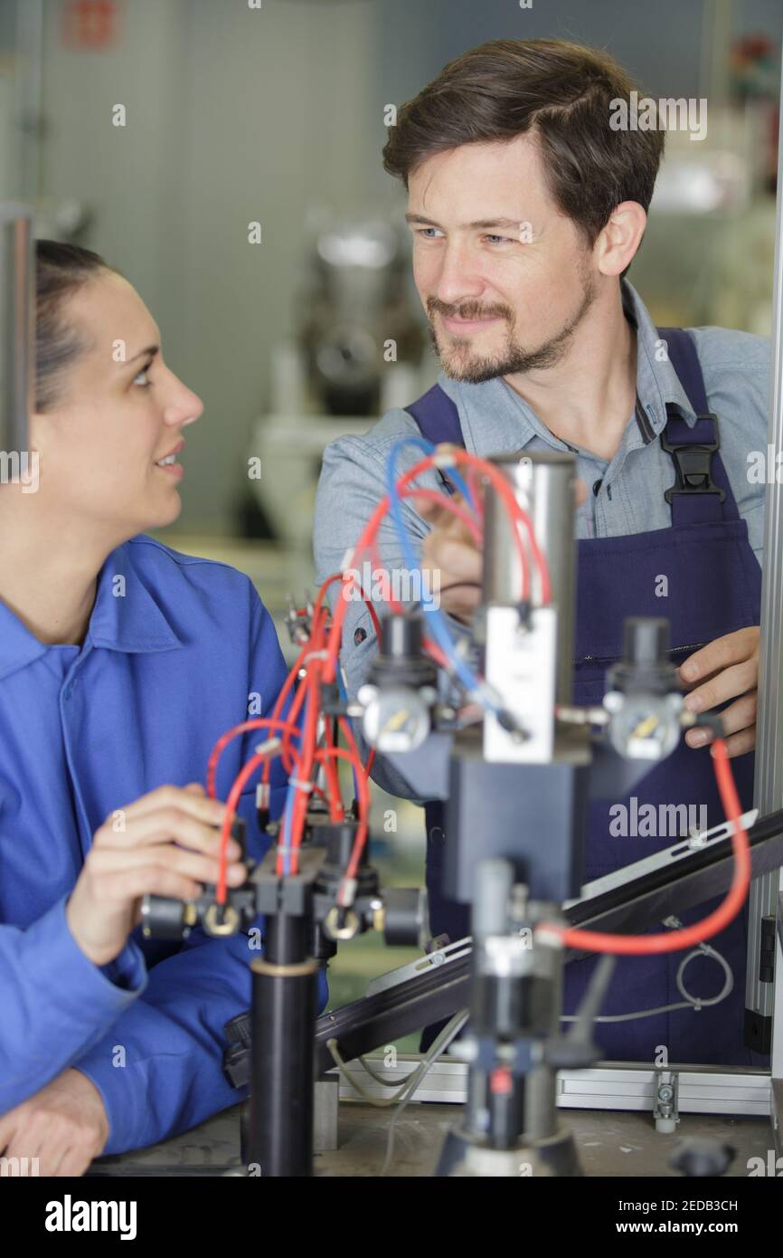 industry technicians working together on project Stock Photo - Alamy
