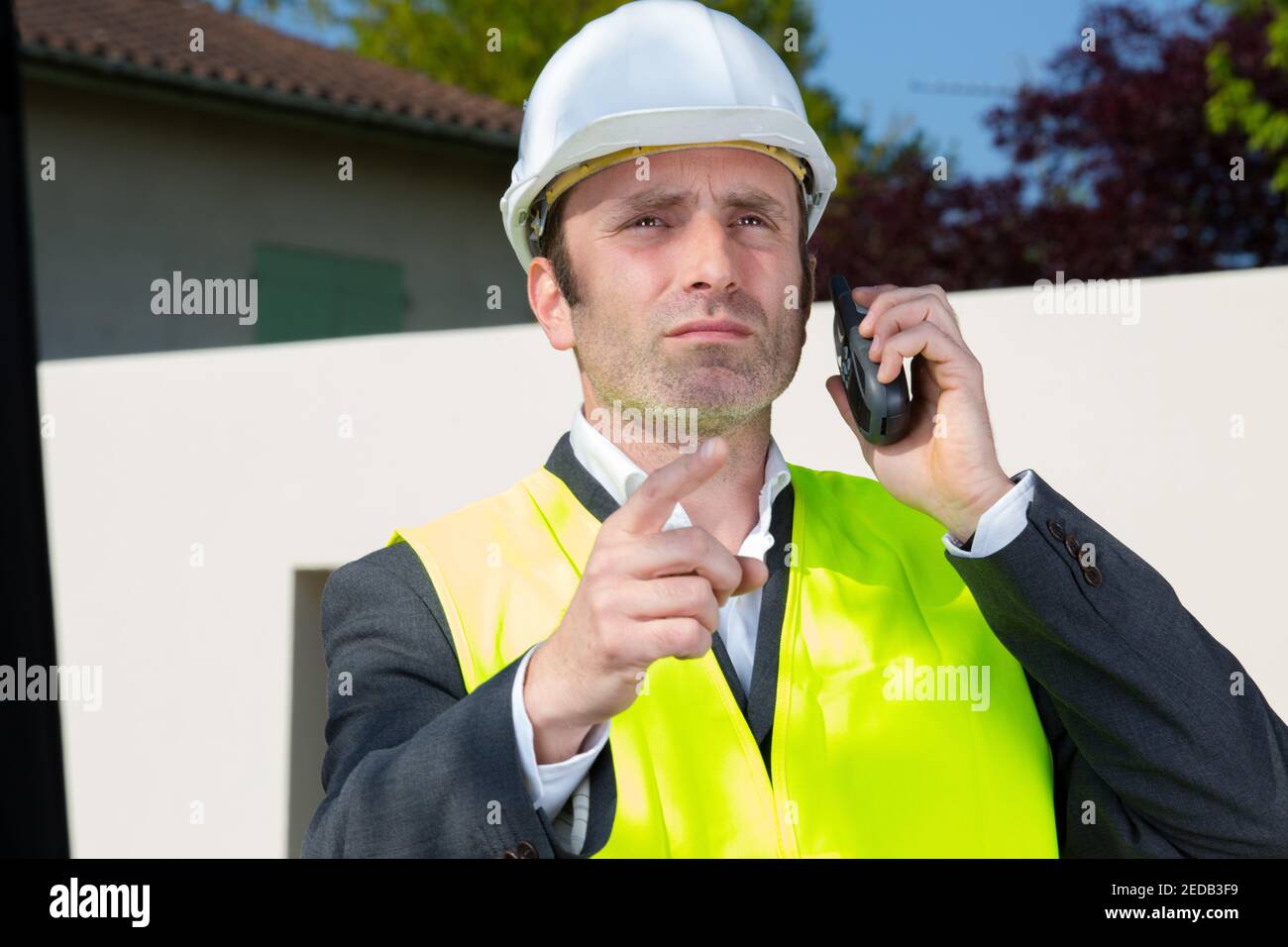 engineer talking into walkie talkie Stock Photo - Alamy